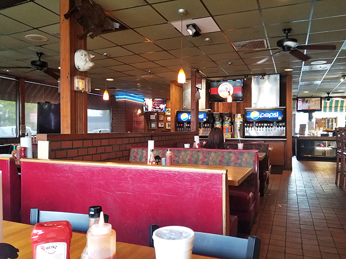 The dining room says "stay awhile" with its unpretentious comfort—a place where sauce on your shirt is a badge of honor.