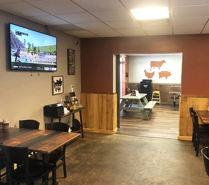 The wooden wainscoting and meat-cut diagrams create that perfect BBQ joint atmosphere&mdash;educational and appetizing all at once.