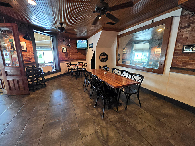 The warm wood ceiling and exposed brick walls create a dining room that feels like a hug from your favorite aunt&mdash;comforting and genuine.