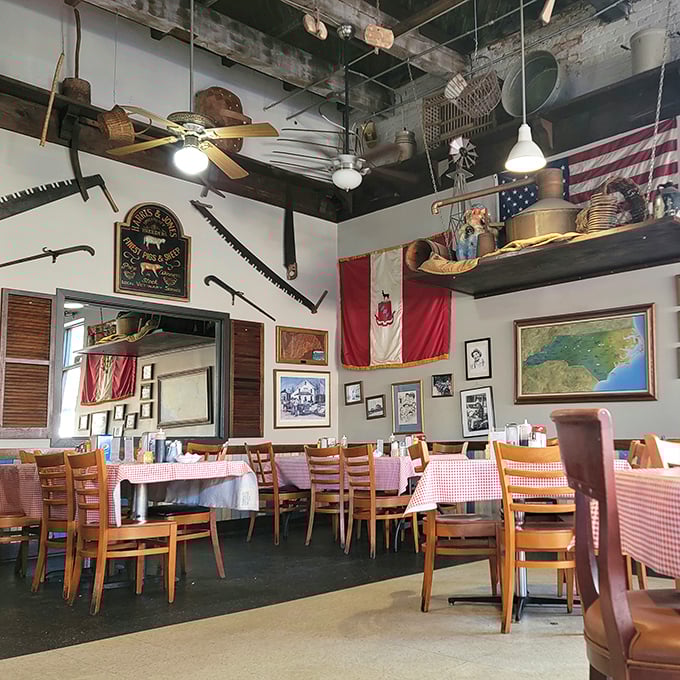 Every inch of wall space tells a story, with flags, farm tools, and memorabilia creating a museum of Southern nostalgia.