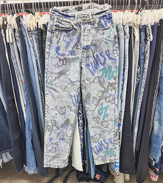 Graffiti jeans that tell a story louder than words. Either teenage artistic expression or evidence that someone let their toddler loose with fabric markers.