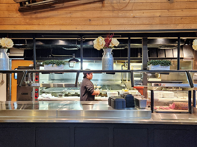 A glimpse into the kitchen battlefield where culinary magic happens&mdash;spotless stainless steel and focused chefs turning raw ingredients into memories.