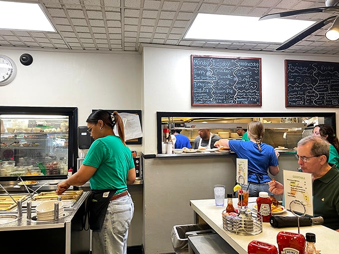 Where the magic happens: The Echo's kitchen window offers a glimpse into the choreographed breakfast ballet that feeds Hyde Park.