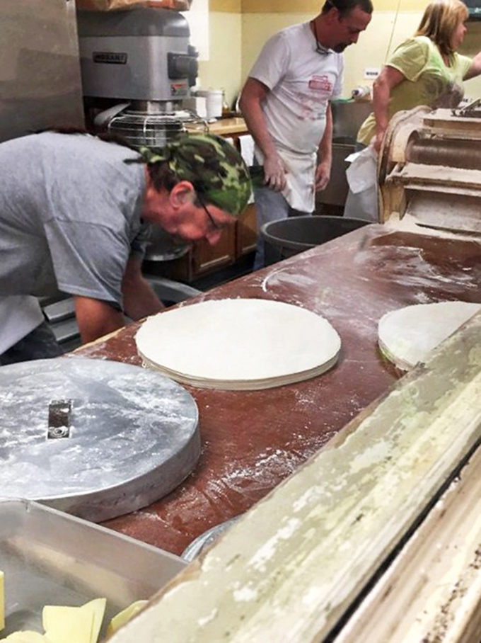 Behind the scenes, the dough-making process hasn't changed in decades. Why mess with pizza perfection?