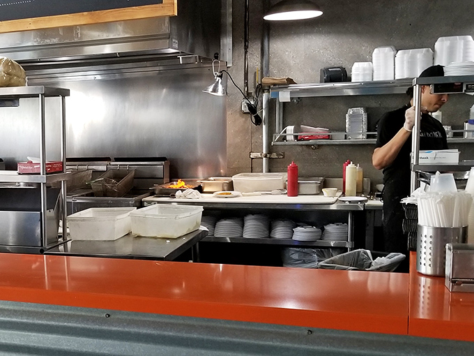 The kitchen's organized chaos reveals the serious business of seafood perfection. Where magic happens with nothing more than heat, skill, and respect for ingredients.