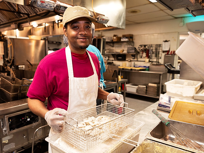 Another kitchen artist at work, turning simple ingredients into the stuff of local legend.