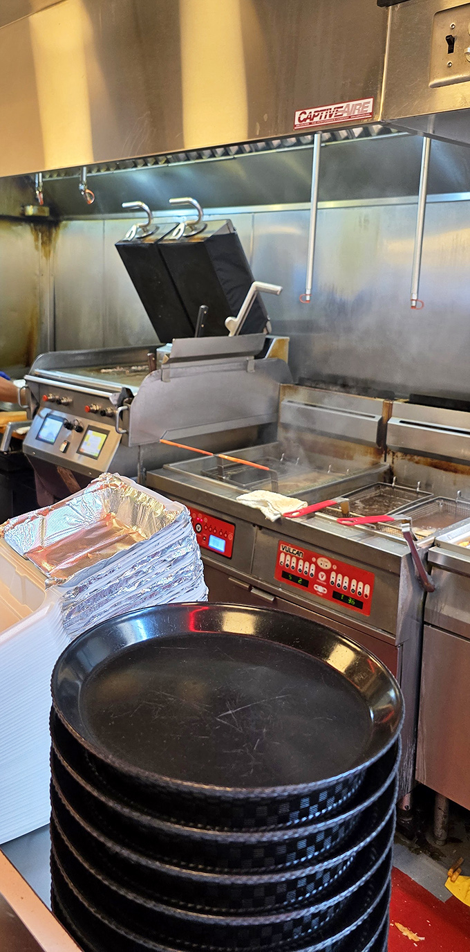 The kitchen battlefield where cheesesteak magic happens. Those aren't just cooking tools&mdash;they're instruments of joy.