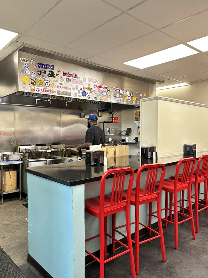 Where the magic happens&mdash;a kitchen adorned with stickers that tell stories of travels, teams supported, and burgers conquered.