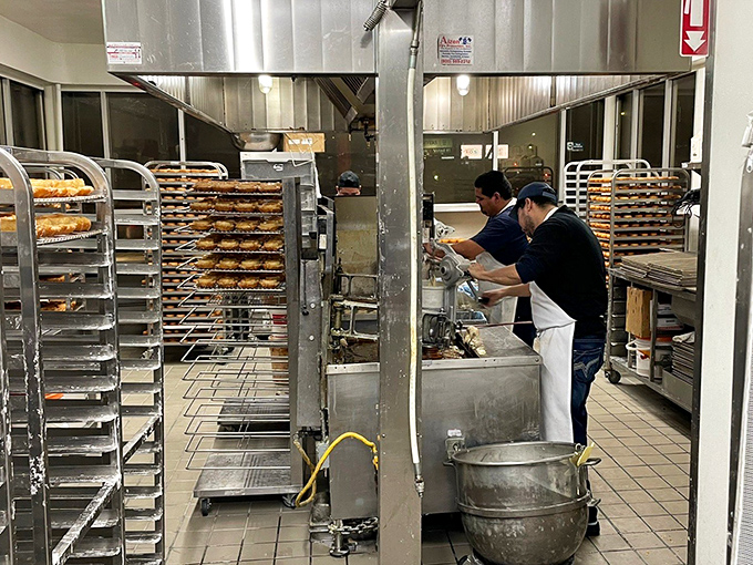 Racks upon racks of freshly made donuts await their moment of glory. This is what dreams are made of&mdash;specifically, my dreams.