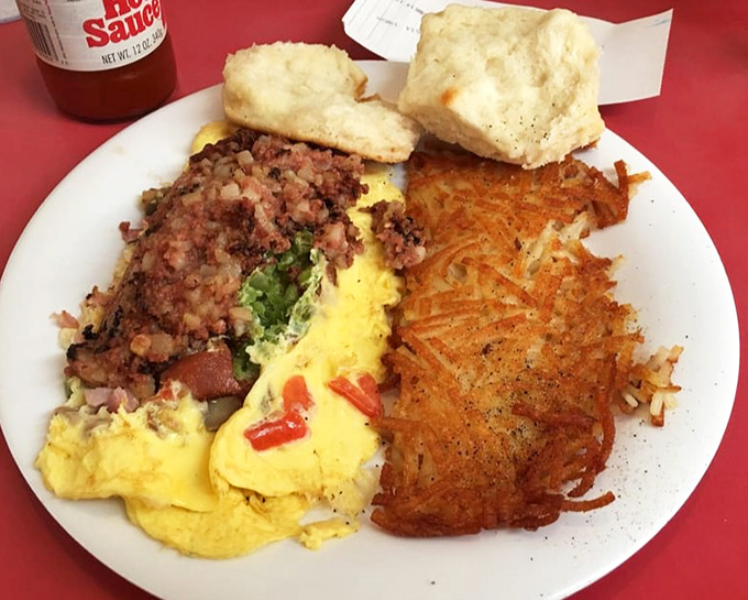 The breakfast plate that answers the eternal question: "Why choose between eggs, hash browns, meat, and biscuits when you can have it all?"