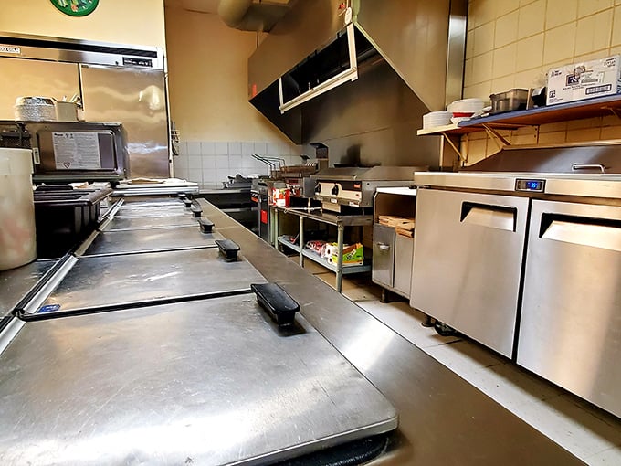 The kitchen&mdash;hallowed ground where pizza magic happens. Those stainless steel counters have seen more dough transformations than a lottery winner's life.