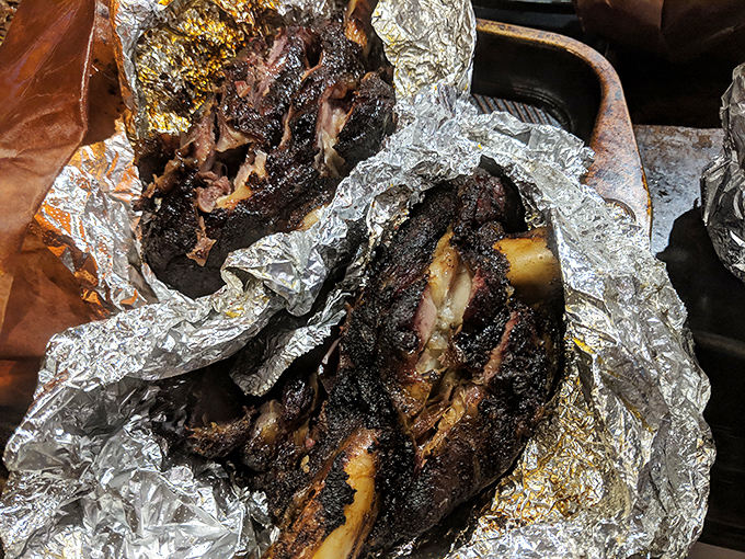 These lamb shanks look like they've been kissed by smoke angels. The foil can barely contain their magnificence.