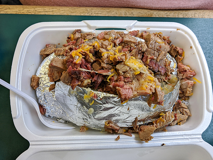 This loaded baked potato isn't just comfort food—it's therapy in a takeout container, no couch required.