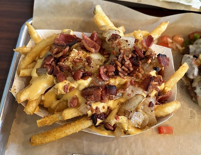 These aren't just cheese fries&mdash;they're a masterpiece of melted goodness, crispy potatoes, and bacon that would make Michelangelo weep.