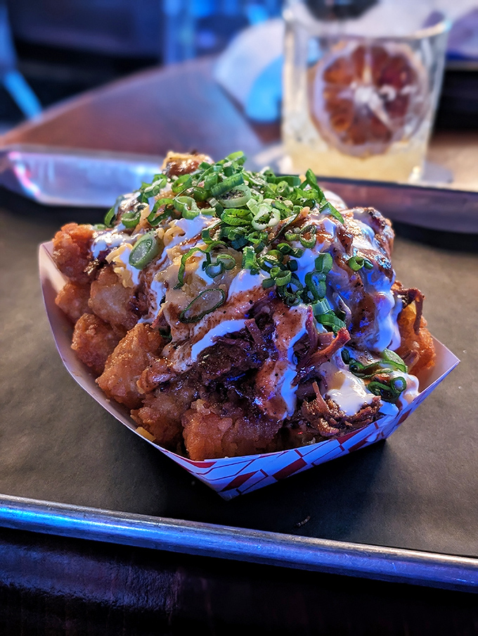 These loaded tots aren't just a side dish&mdash;they're a full-blown flavor festival topped with enough goodies to make a potato feel special.