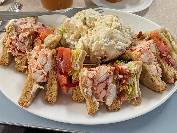 The lobster club sandwich towers like an edible skyscraper, proving that sometimes more is definitely more in the best way.