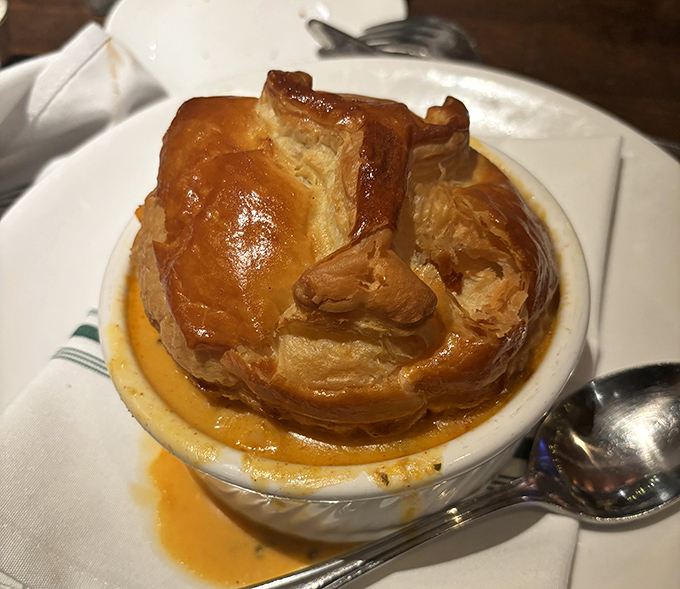 This isn't just pot pie &ndash; it's an architectural marvel of golden pastry hiding a creamy treasure of lobster beneath its domed ceiling.