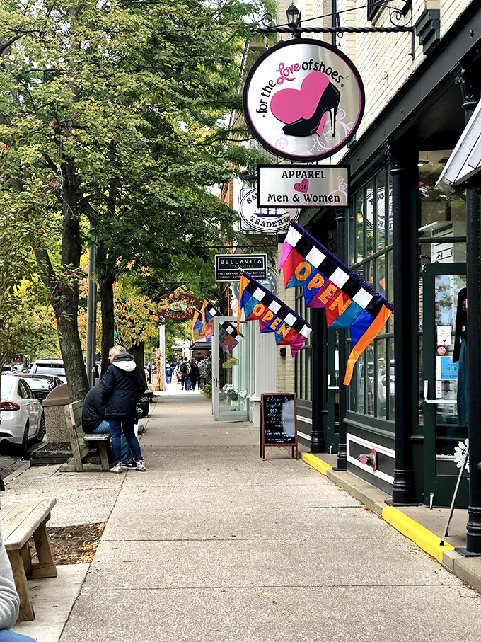 Downtown sidewalks beckon shoppers with colorful flags and storefronts that beg to be explored thoroughly.