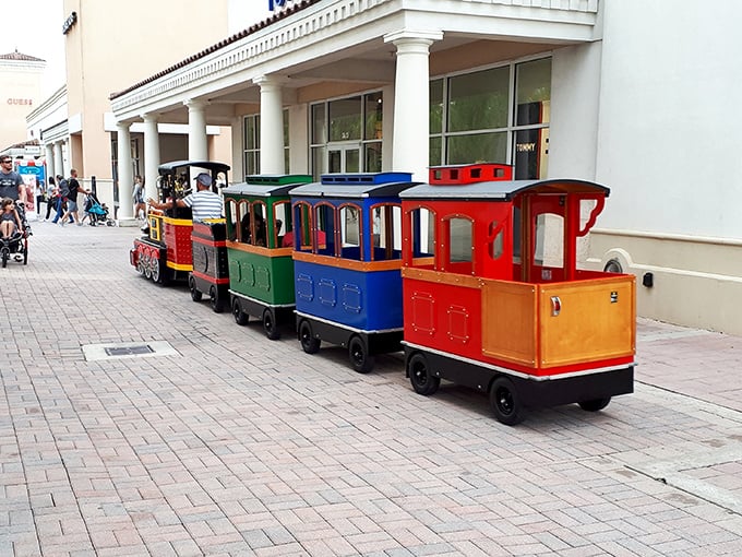 The colorful shopping mall train – childhood joy meets adult convenience in a rainbow-hued choo-choo that saves your feet from retail fatigue.