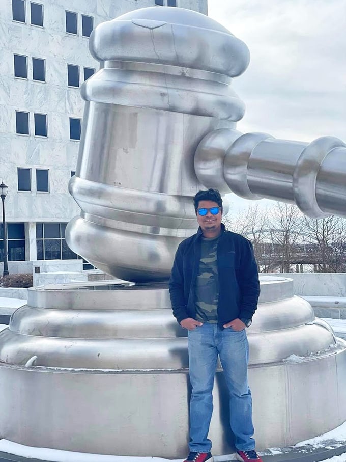 "I swear, Your Honor, the gavel was this big!" A visitor provides perfect scale to show just how enormous this legal icon truly is.