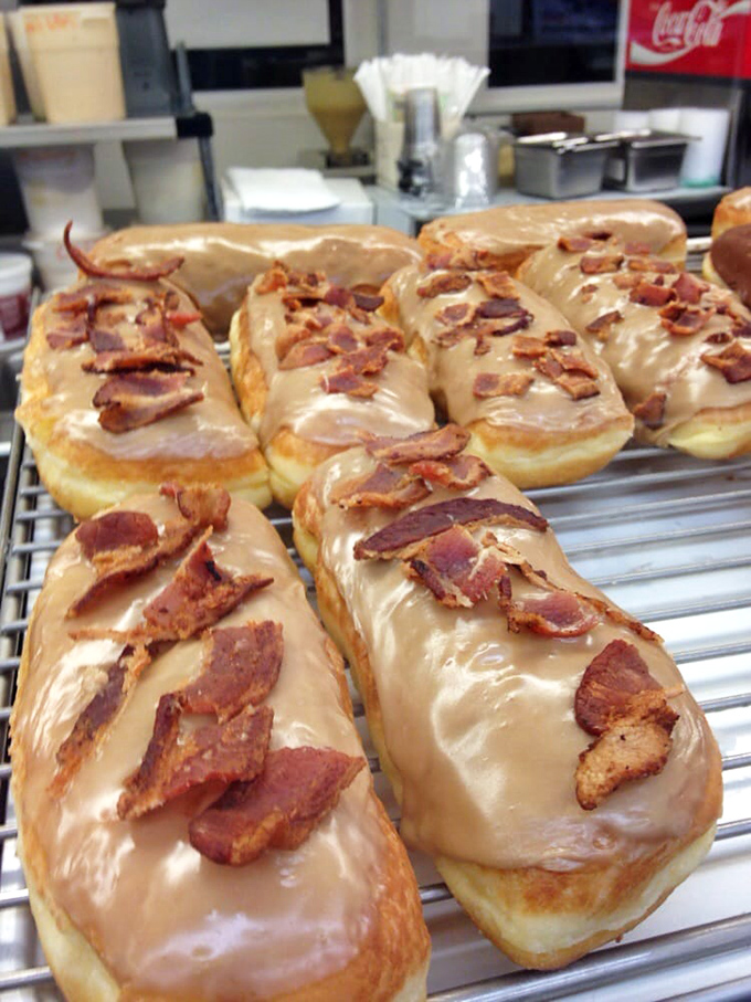 Maple bars with bacon: breakfast's greatest hits album on a single donut. Sweet meets savory in perfect harmony.