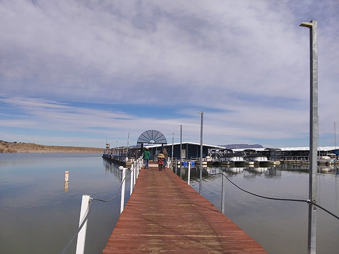 The marina walkway beckons boat enthusiasts and dreamers alike. This wooden path leads to adventures that'll have you reconsidering your landlubber lifestyle. 