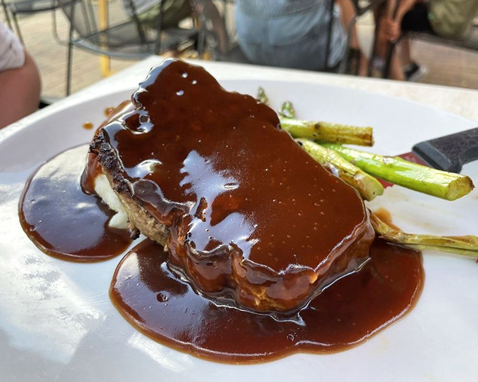 That meatloaf's wearing gravy like it's going to the Oscars &ndash; glamorous, glistening, and absolutely worth the applause.