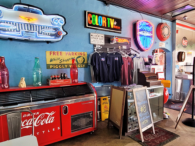 Vintage signs and Coca-Cola memorabilia create the backdrop for a retail corner where you can take a piece of nostalgia home.
