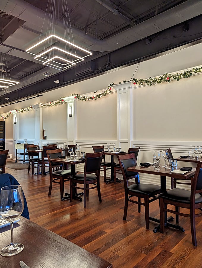 Modern lighting fixtures float above the dining room like illuminated art, casting the perfect glow for both the food and your dining companions.