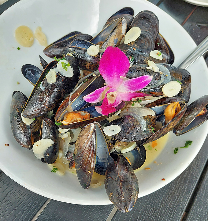 Mussels that look like jewelry &ndash; glistening shells open to reveal tender morsels, garnished with a touch of unexpected elegance.