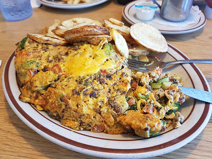 An omelet so stuffed with goodness it requires structural engineering&mdash;where cheese pulls become Instagram moments without trying.