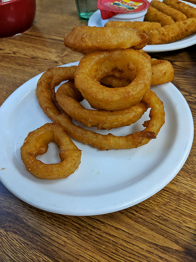 Onion rings with the structural integrity of Olympic gold&mdash;crispy, substantial, and demanding to be the main event rather than a side dish.