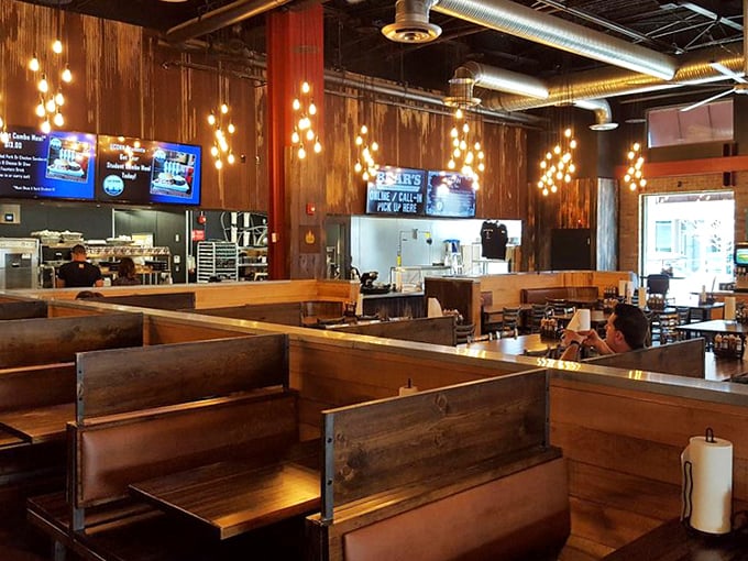 Church-like wooden booths where barbecue devotees come to worship at the altar of smoked meat and comfort sides.