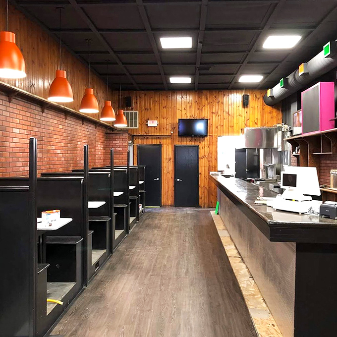 Wood paneling and industrial touches create a space that feels both nostalgic and modern—like comfort food that's been reimagined for today's flavor-seekers.