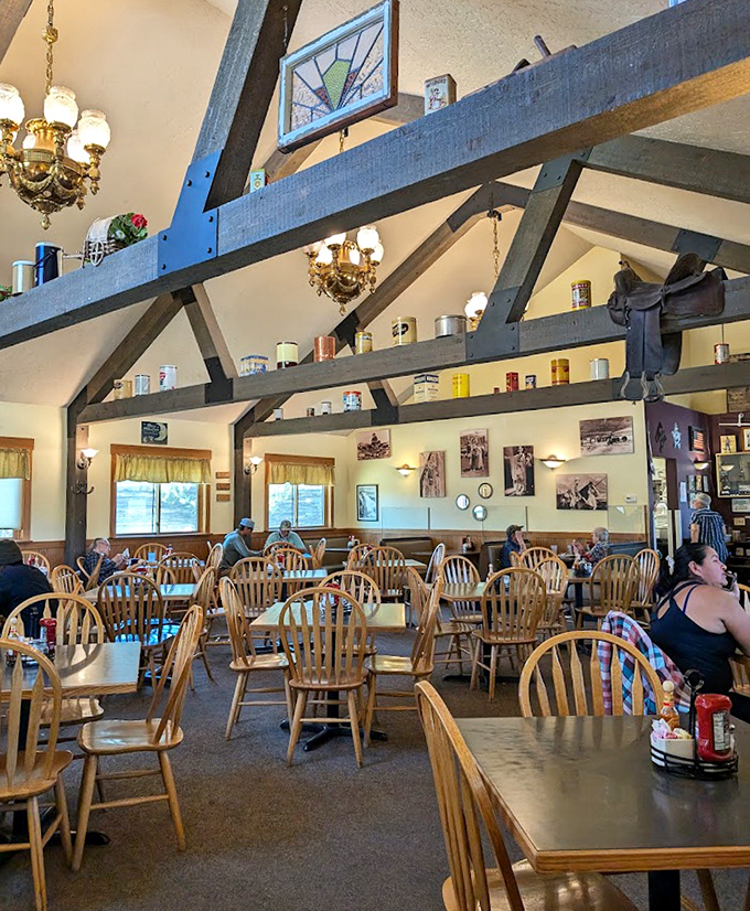 Cathedral-like beams watch over diners like benevolent breakfast guardians. The chandelier isn't just lighting&mdash;it's jewelry for a room that deserves to be dressed up.