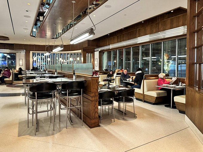 Evening at Tops transforms the space into a warm sanctuary where booths become private dining rooms and conversations flow as freely as the coffee.