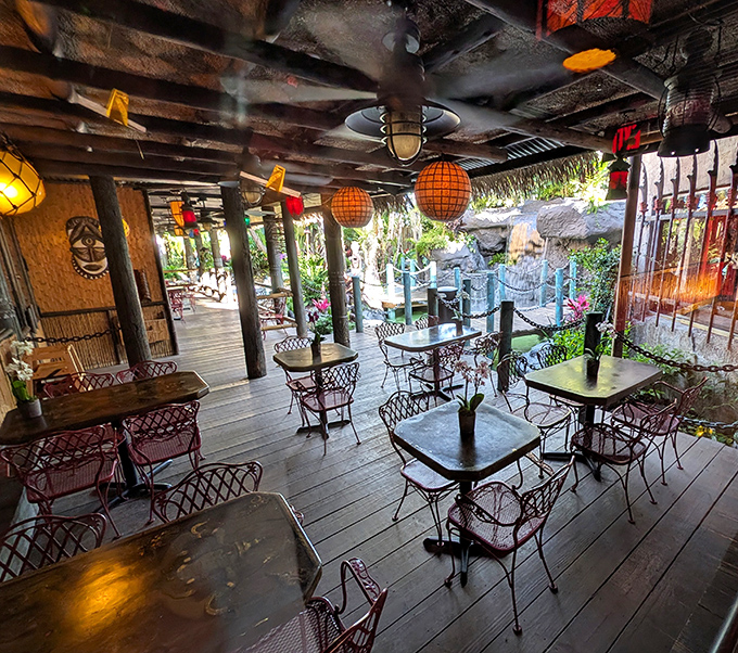 The outdoor dining deck where tiki torches and paper lanterns transform ordinary evenings into island-time magic.