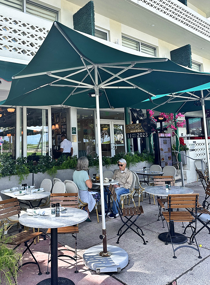 Sidewalk seating under turquoise umbrellas&mdash;where people-watching becomes an Olympic sport and coffee sipping its perfect training regimen.