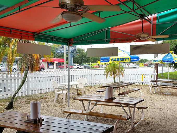 The covered outdoor area&mdash;where ceiling fans battle Florida heat while you battle hunger. The red and green ceiling adds a touch of year-round Christmas spirit.
