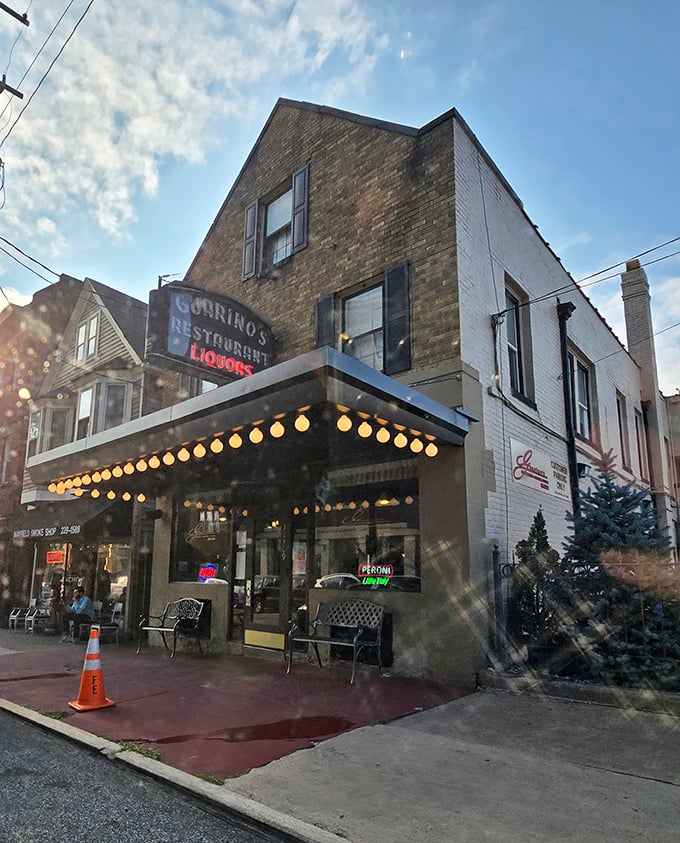 Guarino's exterior view captures that magical moment when day transitions to evening and restaurant windows begin to glow with possibility.