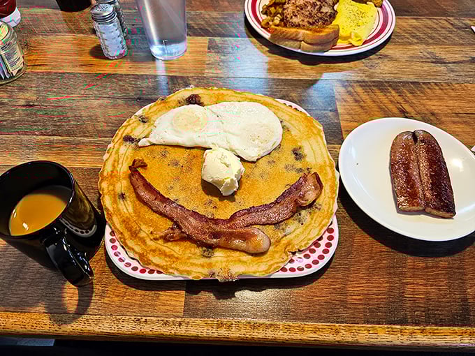 This pancake isn't just smiling at you&mdash;it's daring you to finish it. The butter melting into those golden circles is breakfast poetry.