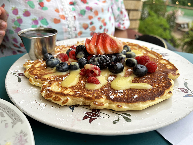 A pancake that deserves its own Instagram account&mdash;golden, fluffy, and adorned with berries that pop like nature's candy.