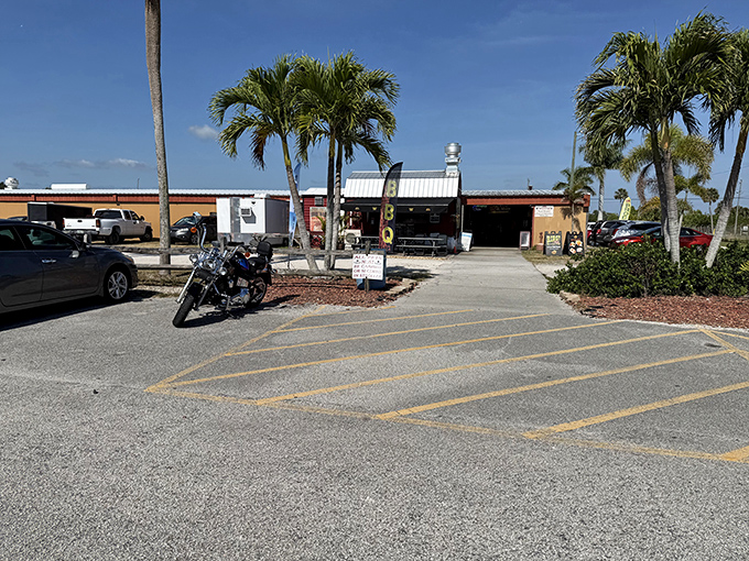 Even the parking lot exudes Florida charm with its palm trees and sunshine. That motorcycle seems to be saying, "Come on in, the bargains are fine!"