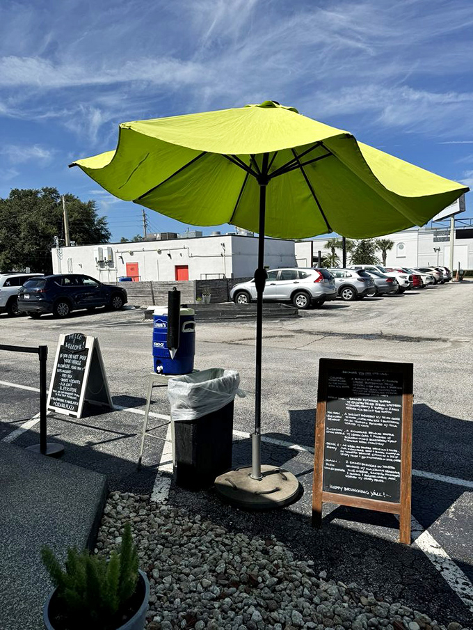 Even the outdoor waiting area stays on brand with that signature lime-green umbrella—a beacon of hope for hungry patrons scanning for parking spots.