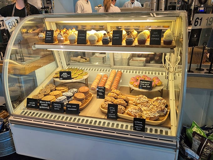 The pastry case: where good intentions about "just having coffee" go to die. Resistance is futile against these golden-baked temptations.