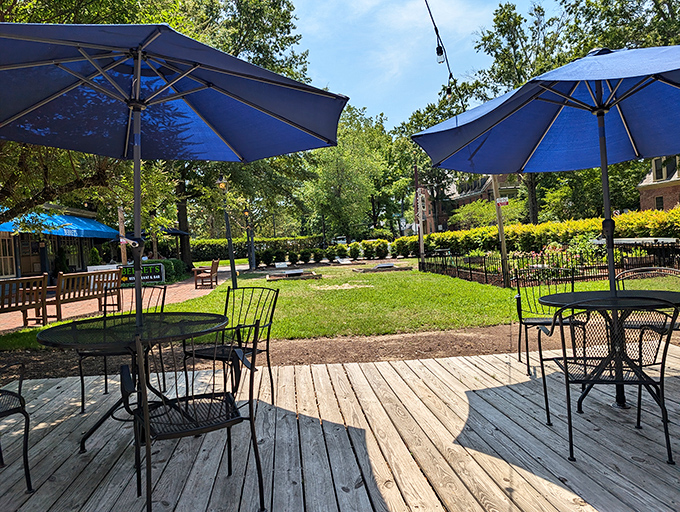 Dappled sunlight, blue umbrellas, and the promise of al fresco dining—this patio practically begs you to linger over lunch and into dinner.