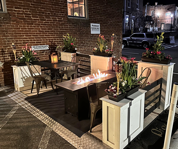 The outdoor patio brings fire and flora together&mdash;a nighttime sanctuary where cocktails taste better under stars and between blooming planters.