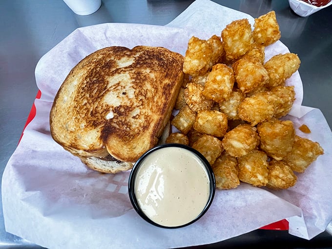 This patty melt with golden tots and house-made ranch isn't just lunch &ndash; it's therapy on a plate. Comfort food that understands you better than your therapist.
