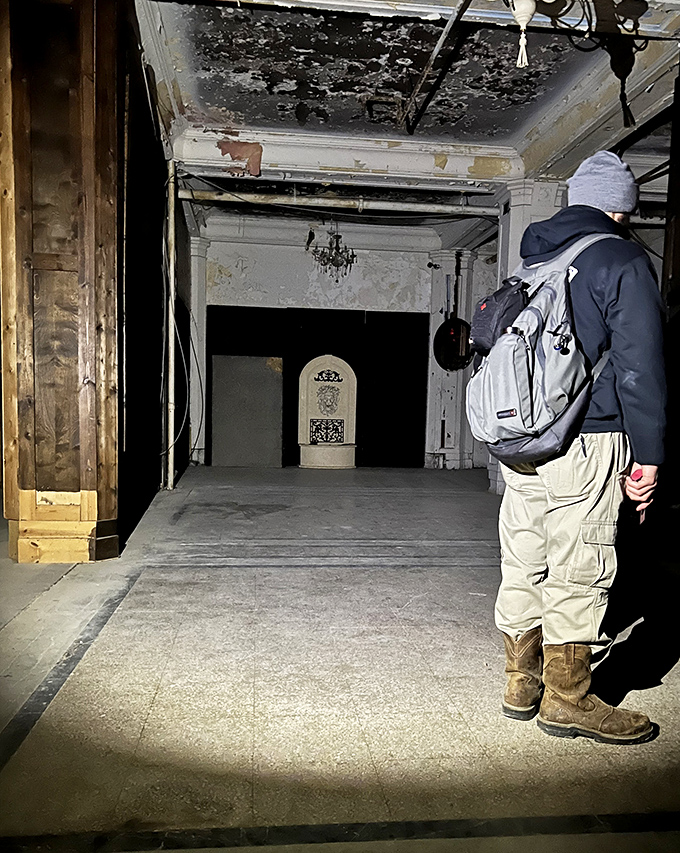 Ghost hunting requires proper equipment. This visitor prepares to document whatever waits in Waverly's shadowy corners and abandoned rooms.