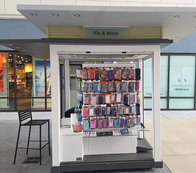 This phone case kiosk stands ready to protect your most precious shopping companion &ndash; the device you'll use to brag about your deals.
